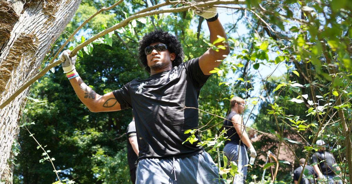 Football Broncos tackle tree clearing for Habitat for Humanity ...